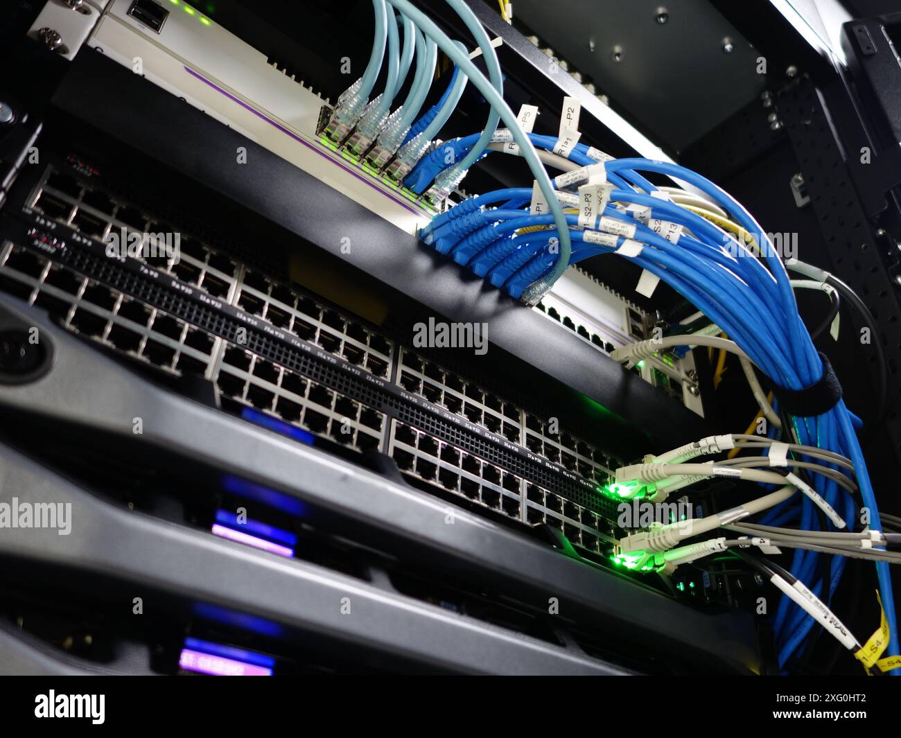 Man fixing server in data center room Stock Photo - Alamy