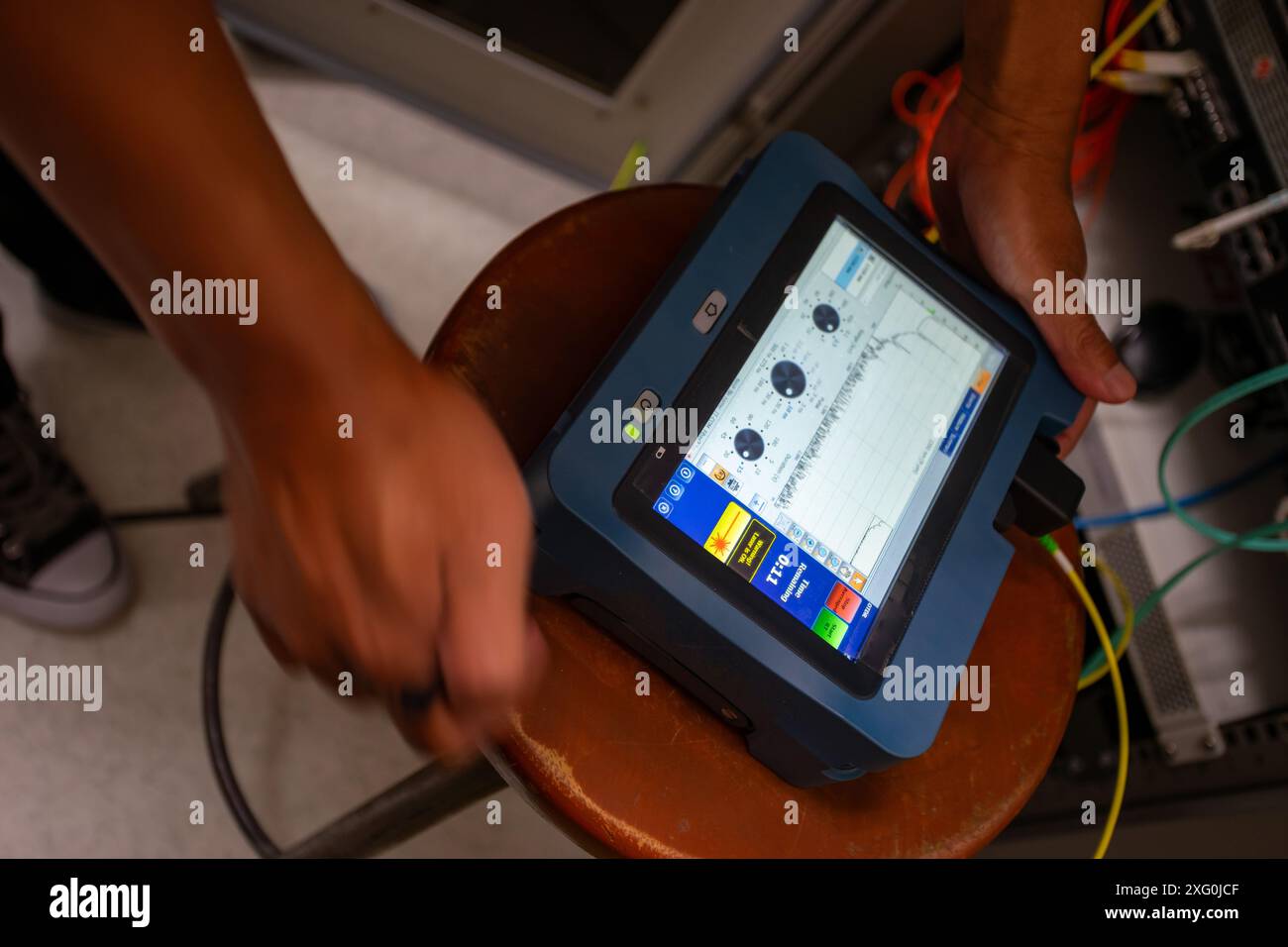 Testing signal Fiber optic cables for readiness for use Stock Photo - Alamy