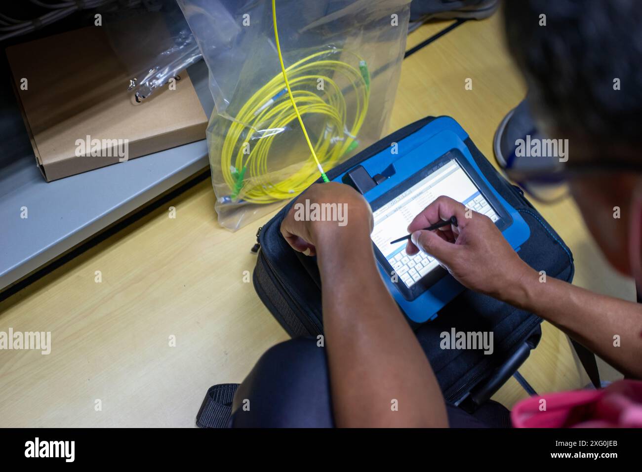 Testing signal Fiber optic cables for readiness for use Stock Photo - Alamy