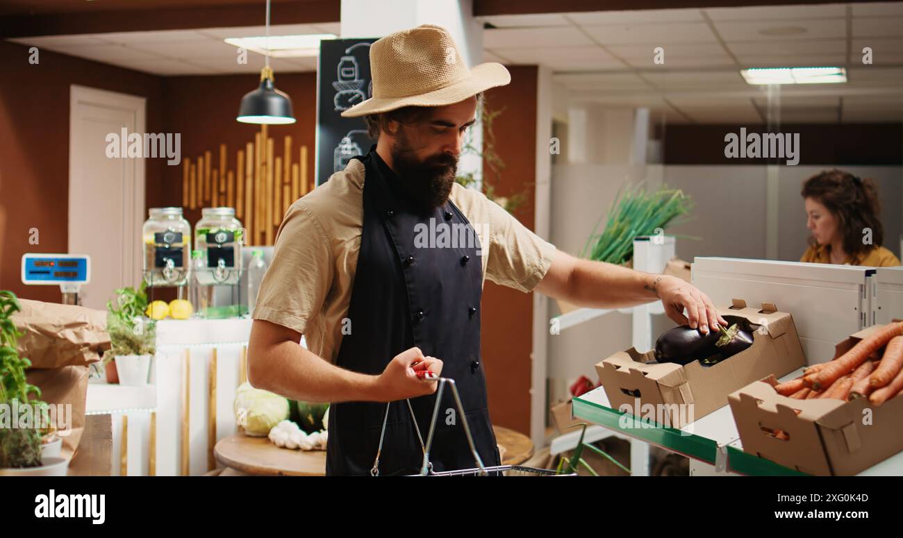 Storekeeper arriving in green living bio supermarket with freshly ...