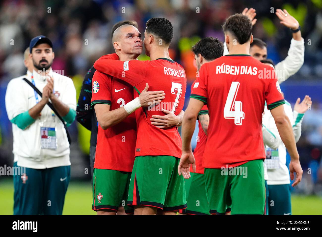 Portugal's Cristiano Ronaldo consoles team-mate Pepe (centre left ...