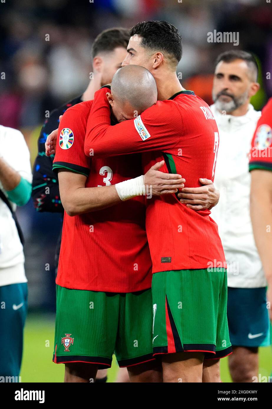Portugal's Cristiano Ronaldo consoles team-mate Pepe (centre left ...