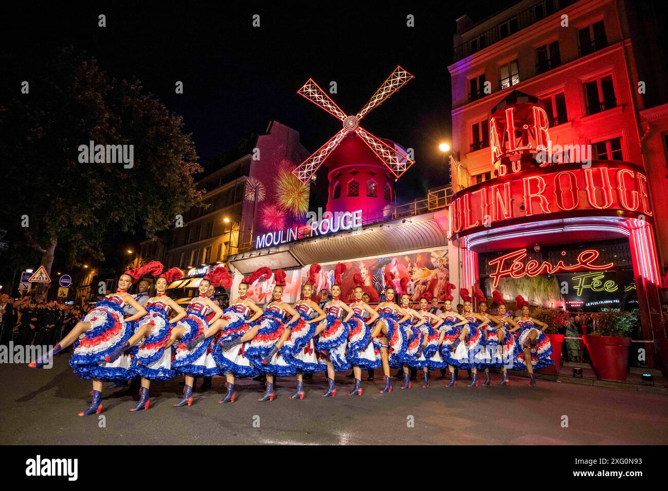 Dancers perform in front of the Moulin Rouge cabaret during the ...