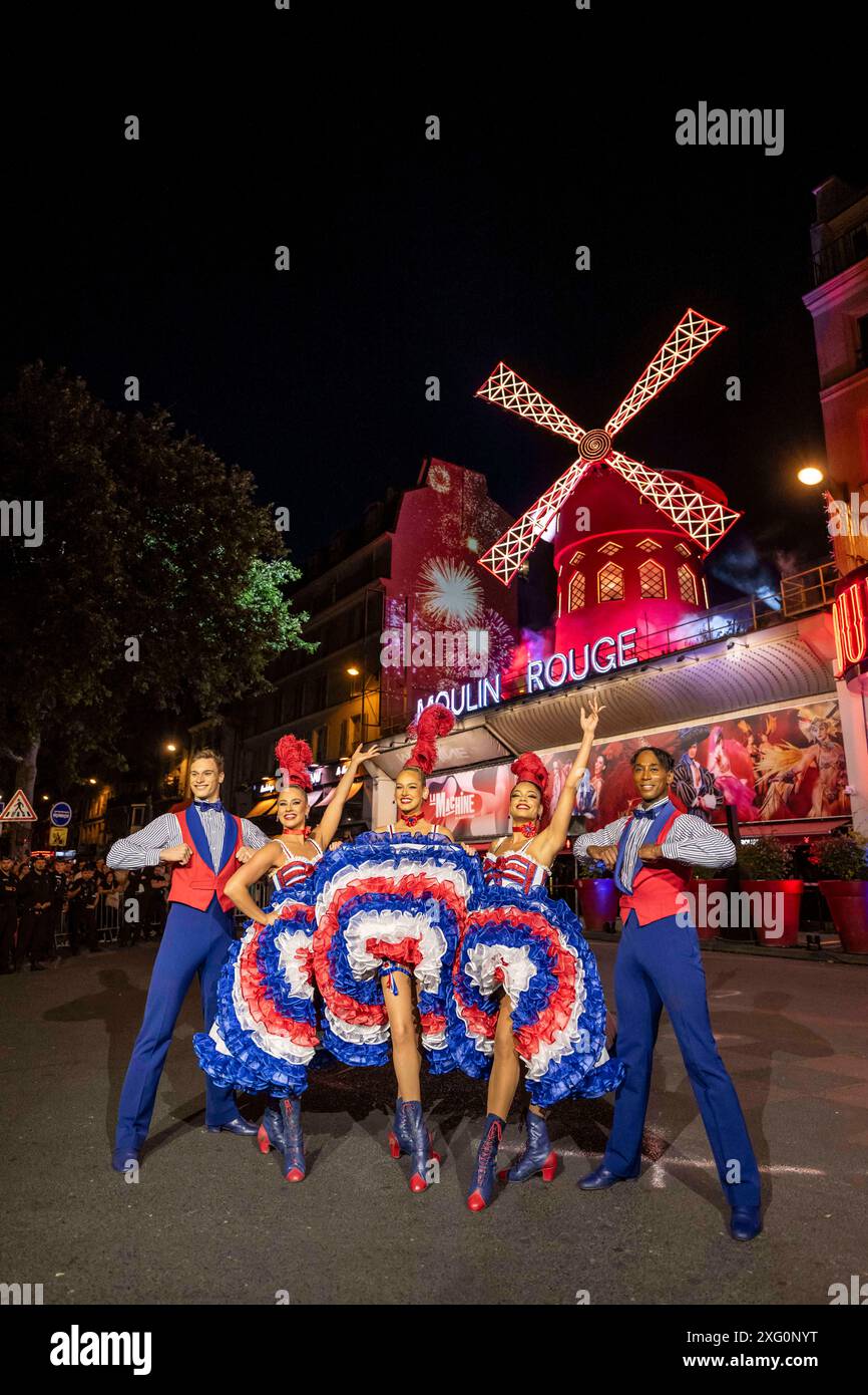 Dancers perform in front of the Moulin Rouge cabaret during the ...