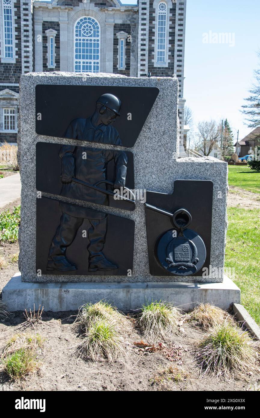 Sculpture of workman making coat of arms at the Church of St. Croix of ...