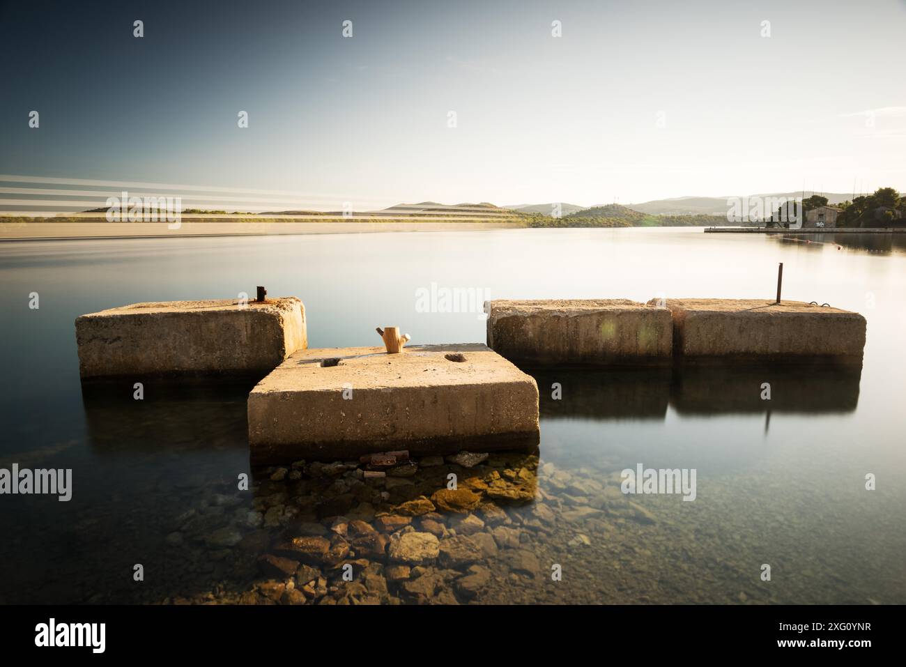 Concrete block and passing vessel in long exposure Stock Photo - Alamy
