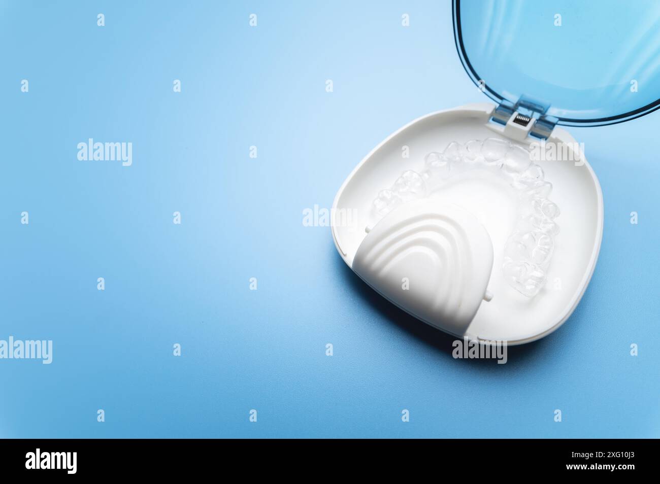 Invisible plastic straighteners lie in a special orthodontic case, a ...