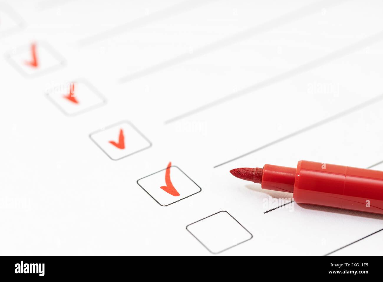 Checklist sheet and red marker. Check list completed task concept. Copy ...