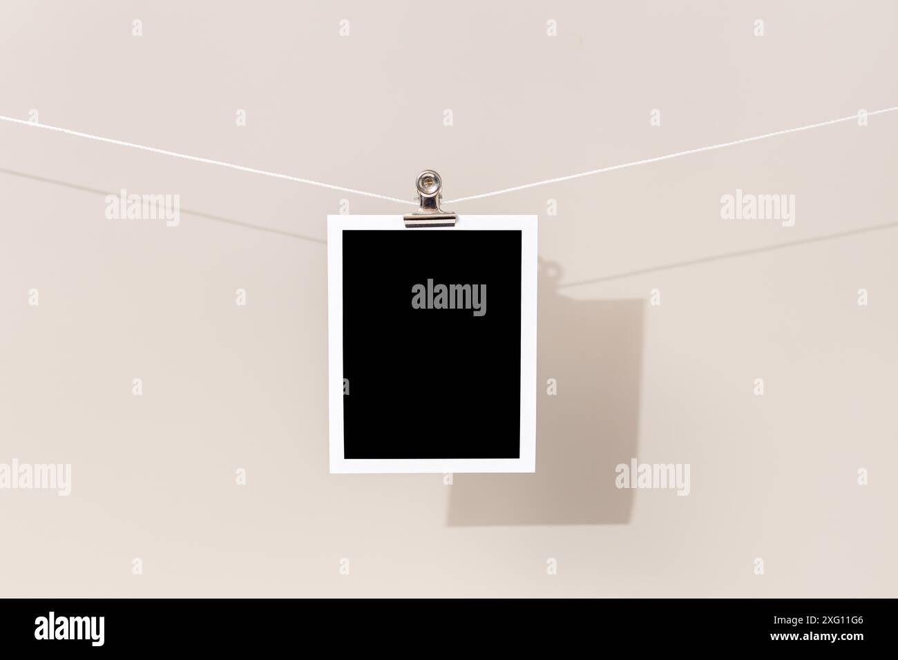 Blank Vintage instant photo frame hanging on a rope. Template Stock ...