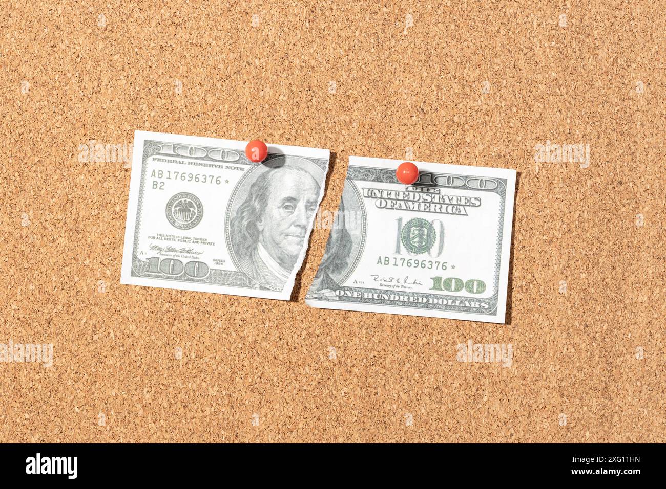 Fake Ripped dollar banknote pinned on cork board Stock Photo - Alamy