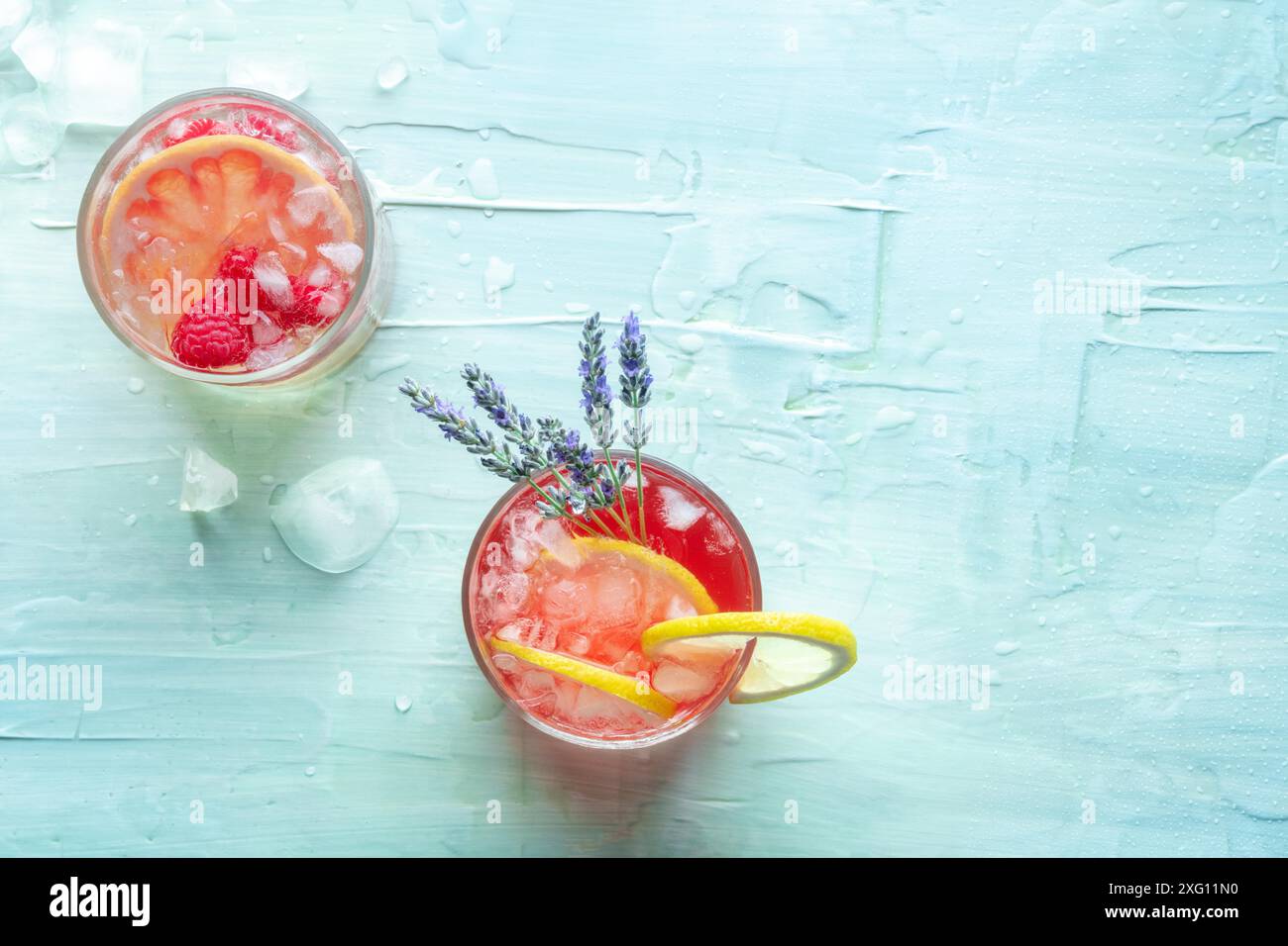 Fresh summer cocktails or mocktails, cold drinks with citrus fruits and ...