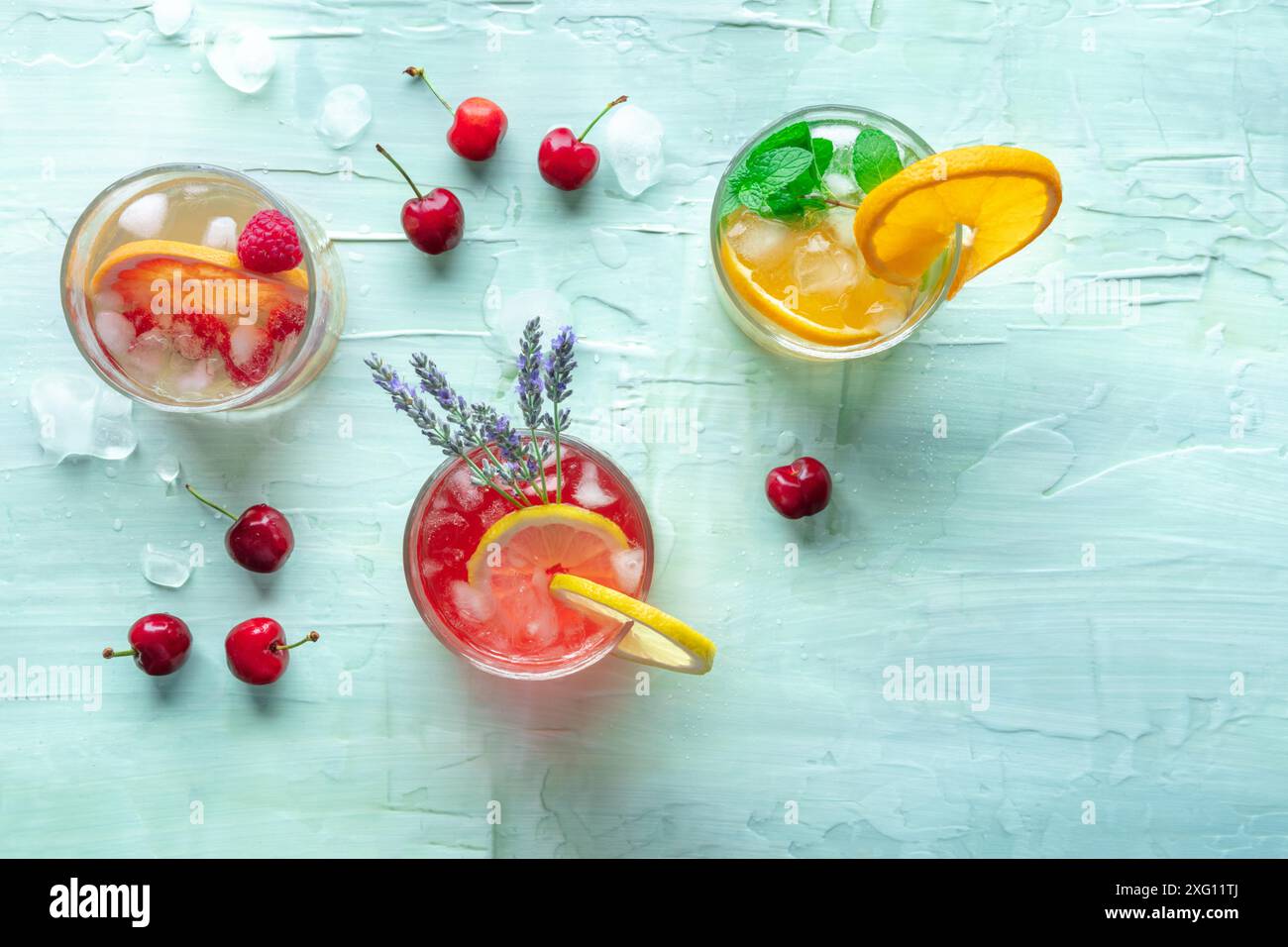 Fresh summer cocktails or mocktails, cold drinks with citrus fruits and ...