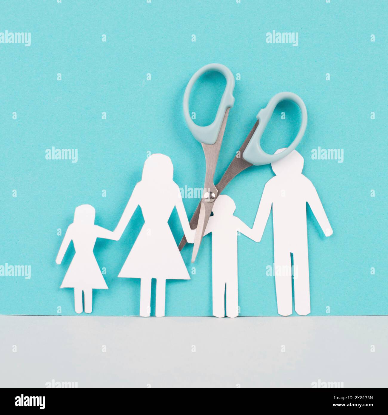 Divored parents, custody battle for the children, scissors cut the ...