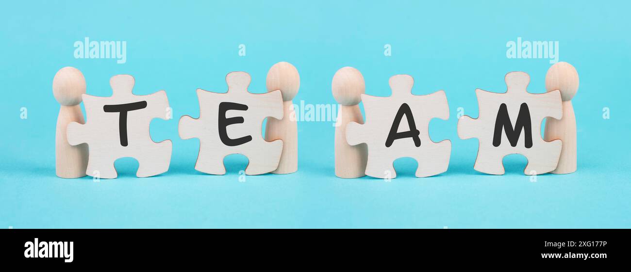 The word team is standing on puzzle pieces, connect the parts together ...