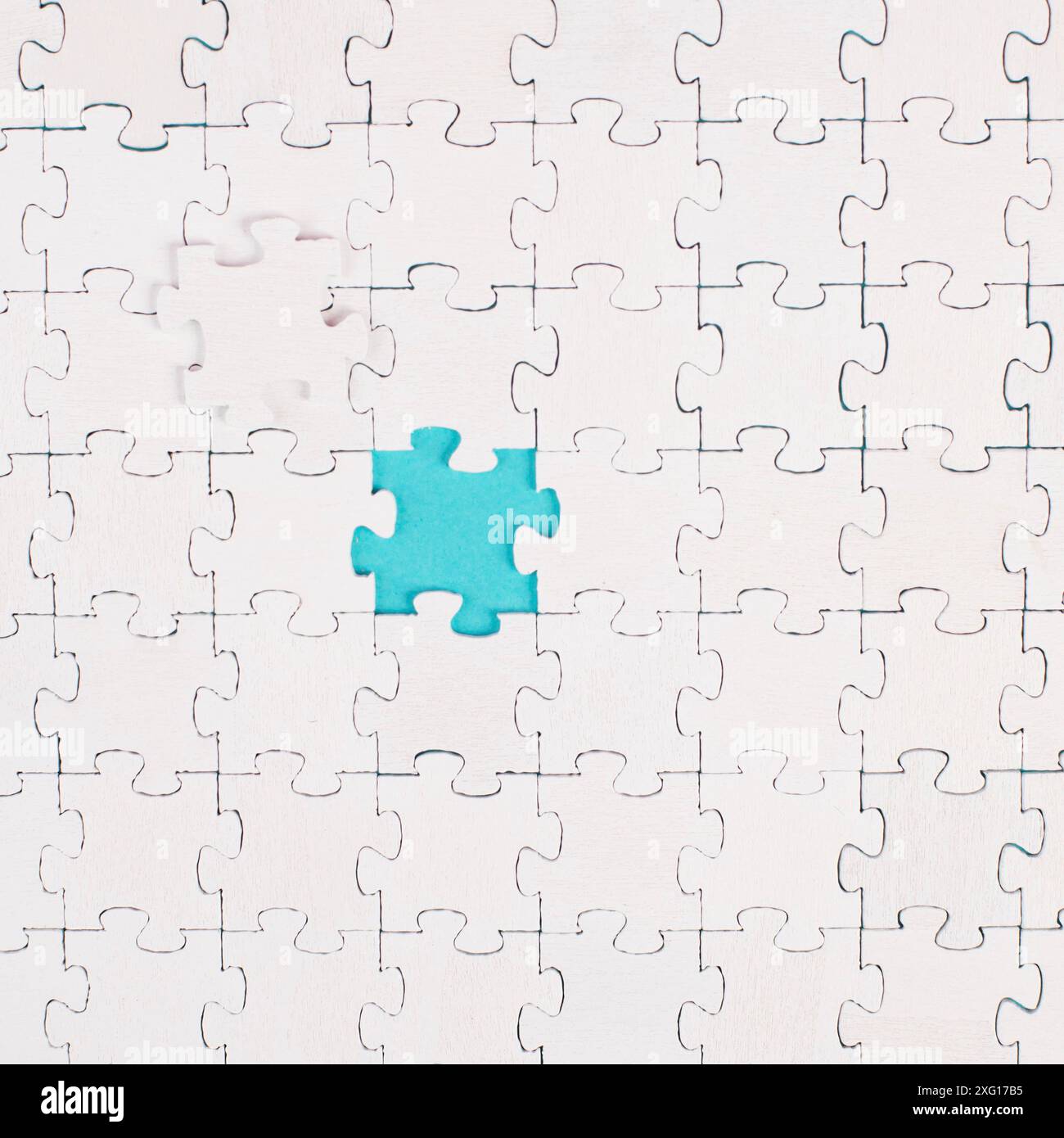 White jigsaw on a blue background, missing parts, working together as a ...