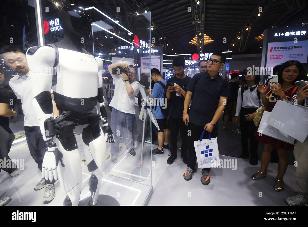 Visitors check out Tesla's second-generation Optimus humanoid robot ...
