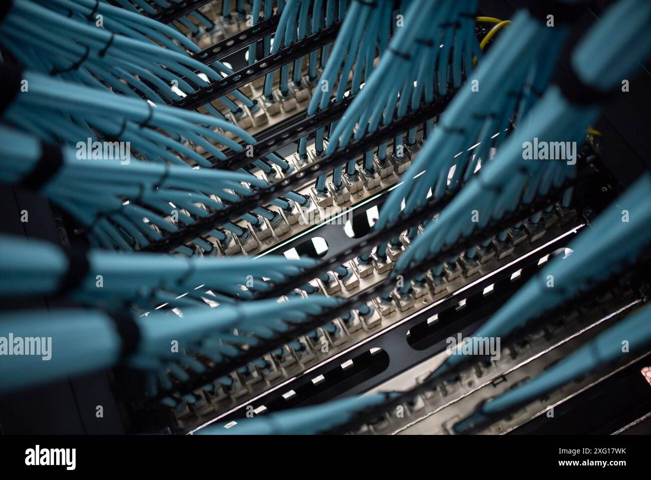 close up of network cables connected to server racks in data center ...