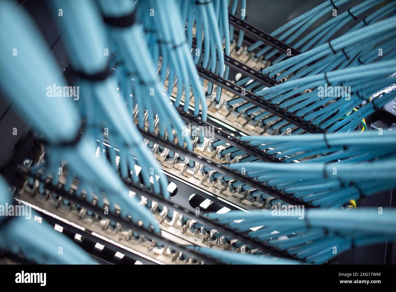 close up of network cables connected to server racks in data center ...