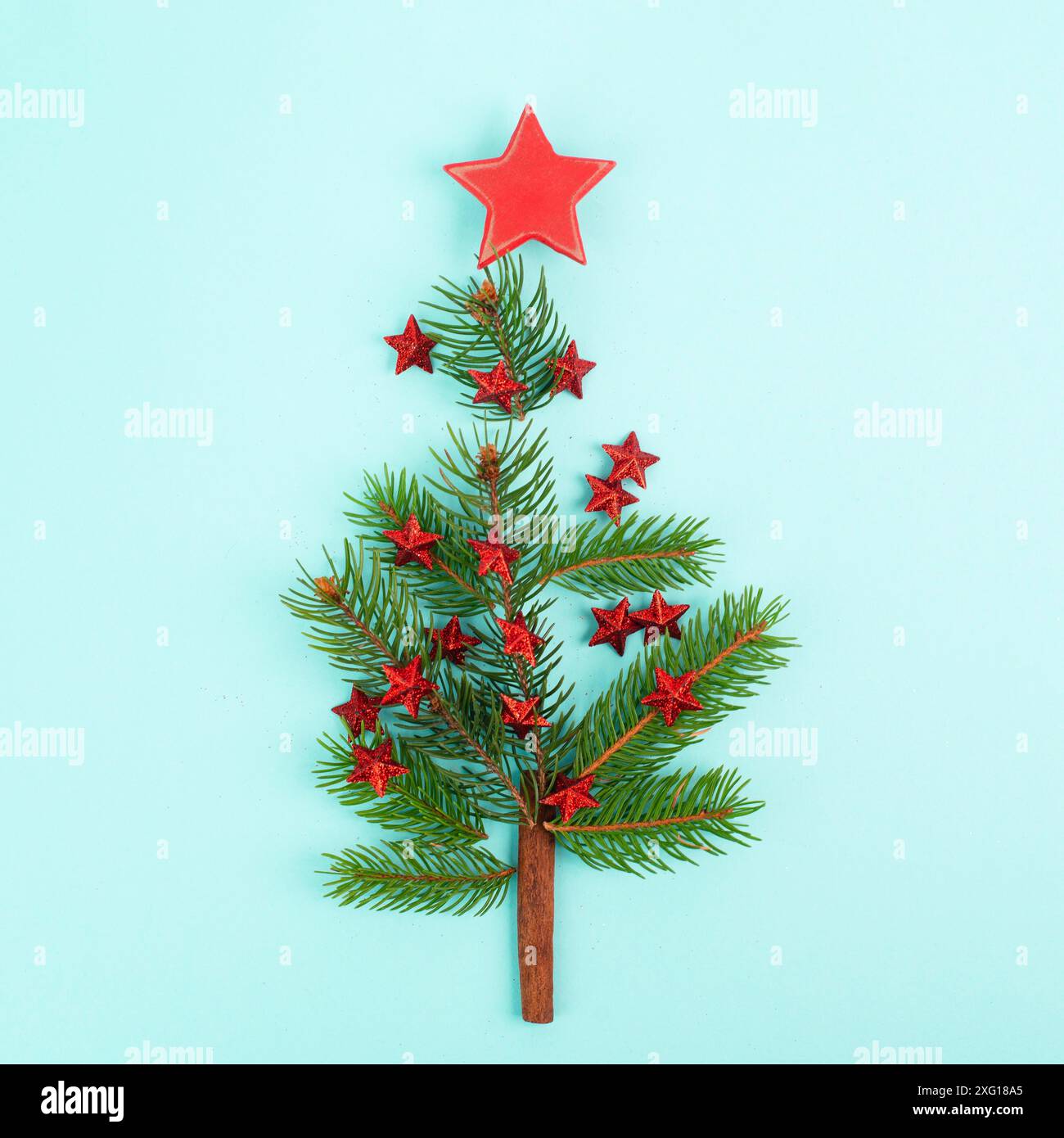 Christmas tree made from fir branches, red stars and a cinnamon stick ...