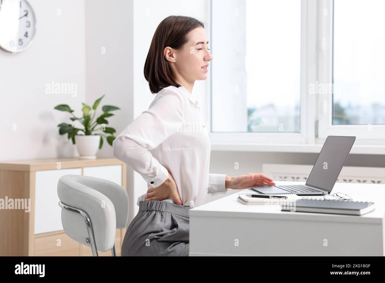 Neck pain unhealthy posture indoors hi-res stock photography and images ...