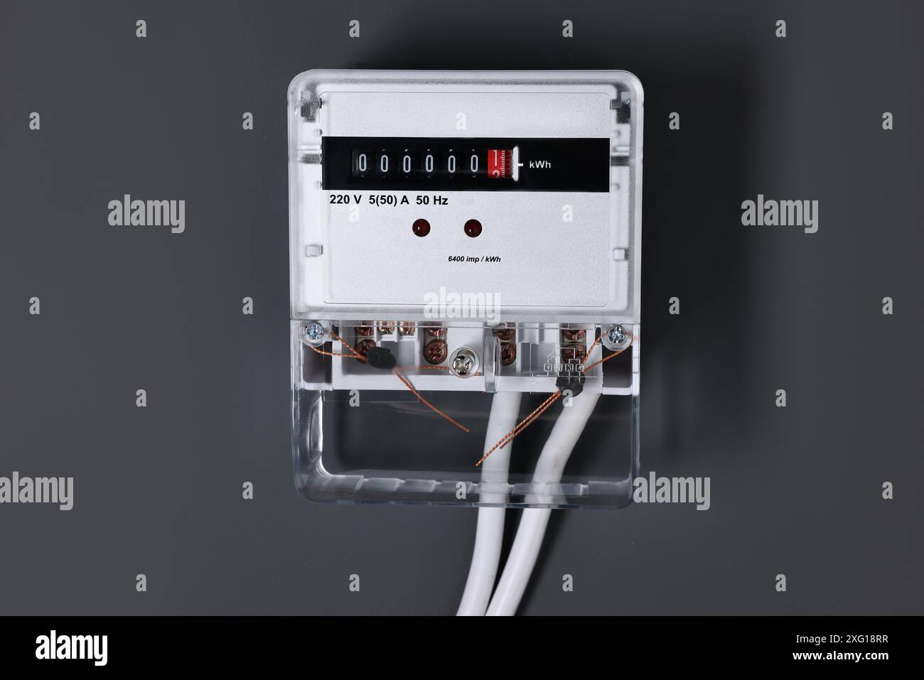 Electric meter on black background. Energy measuring device Stock Photo ...