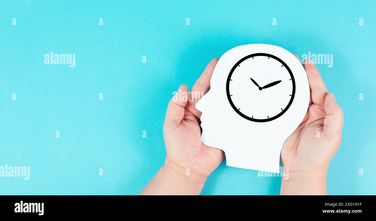Silhouette of a head with a clock, time pressure and management in ...
