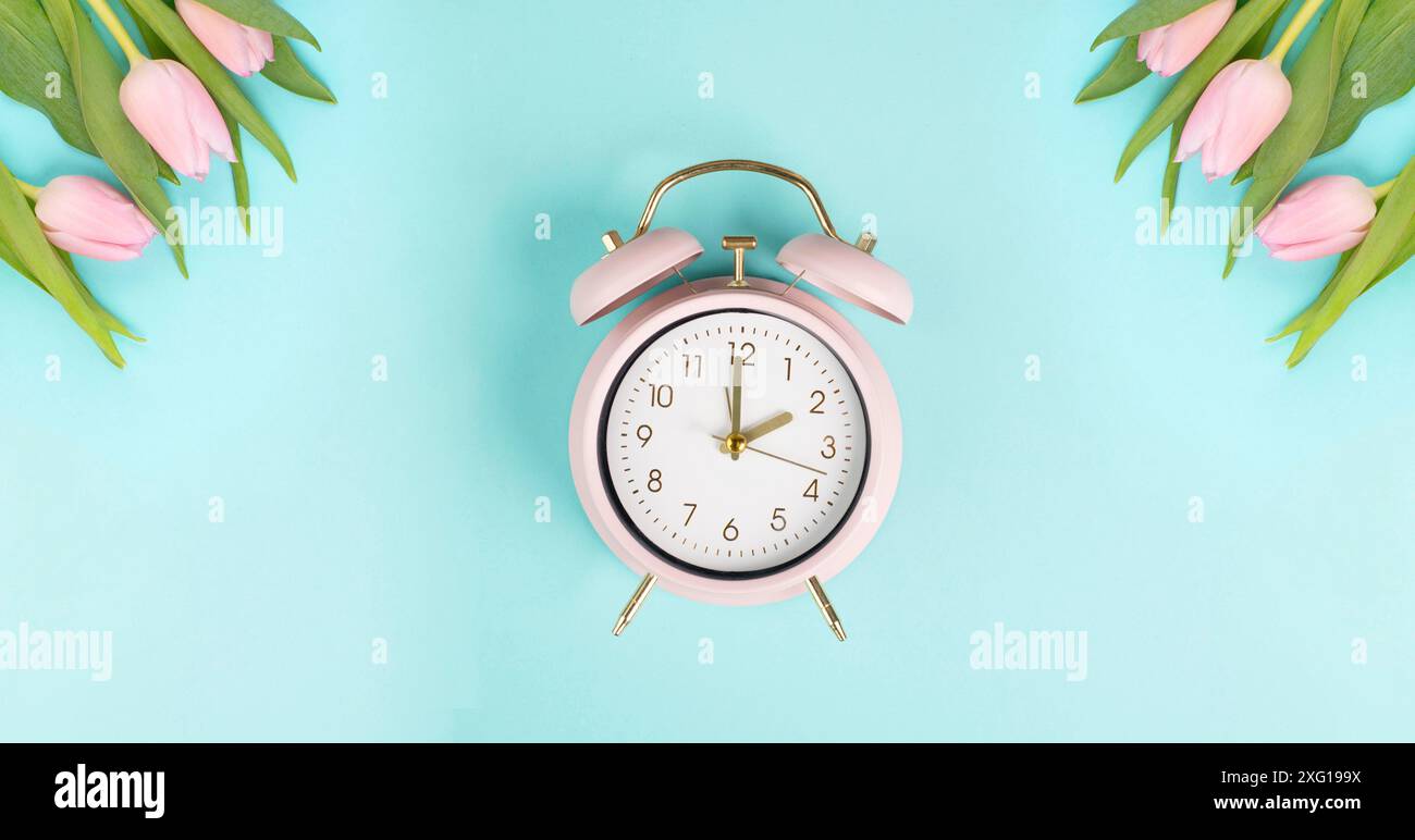 Alarm clock with tulips, switch to daylight saving time in spring ...