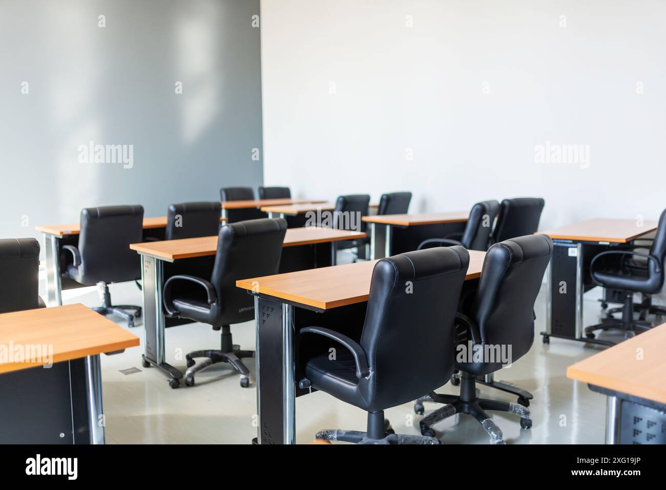 Empty classroom with table and chairs for lecture or seminar in ...