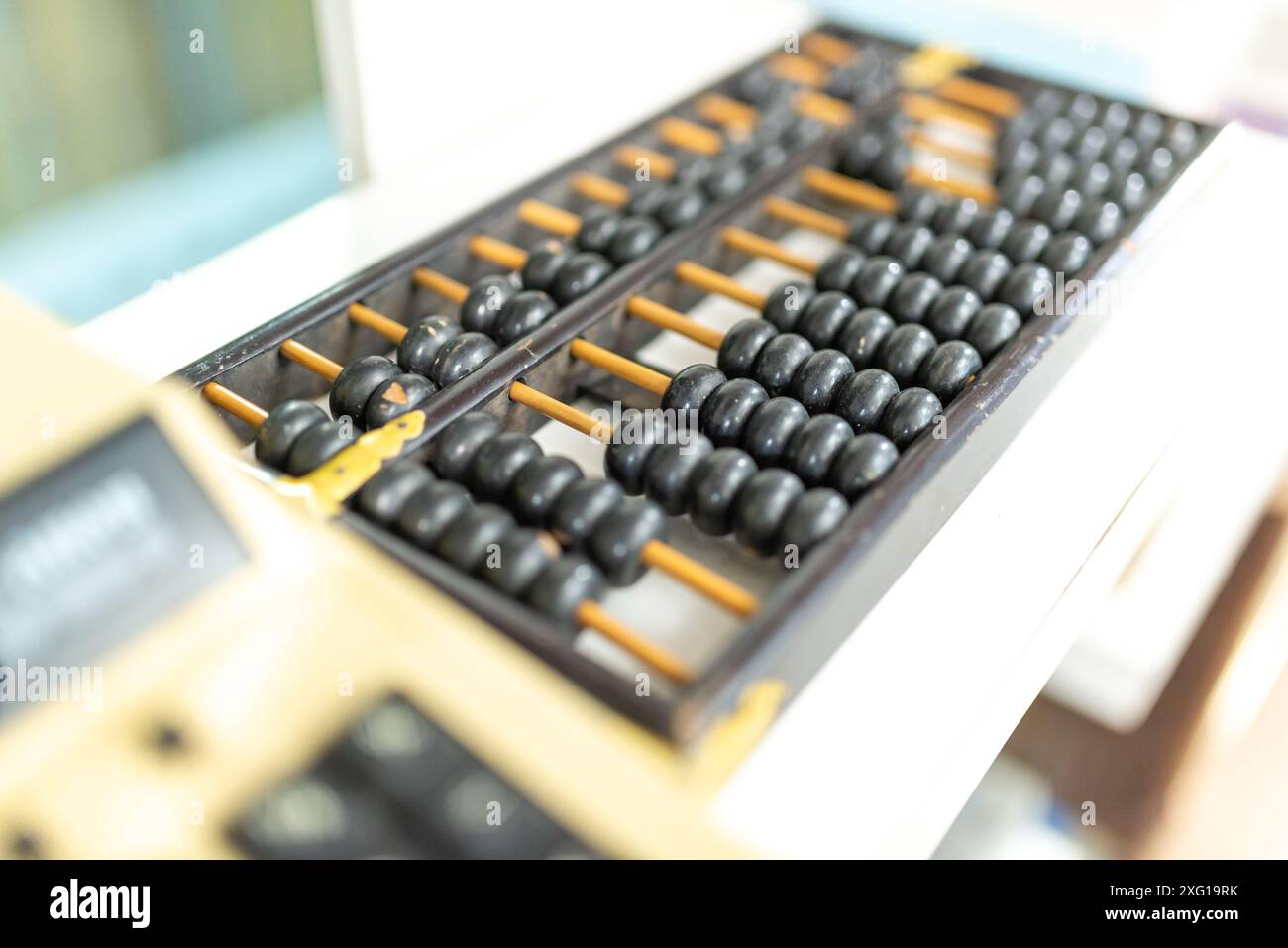 abacus and calculator on the table in the office, business concept ...