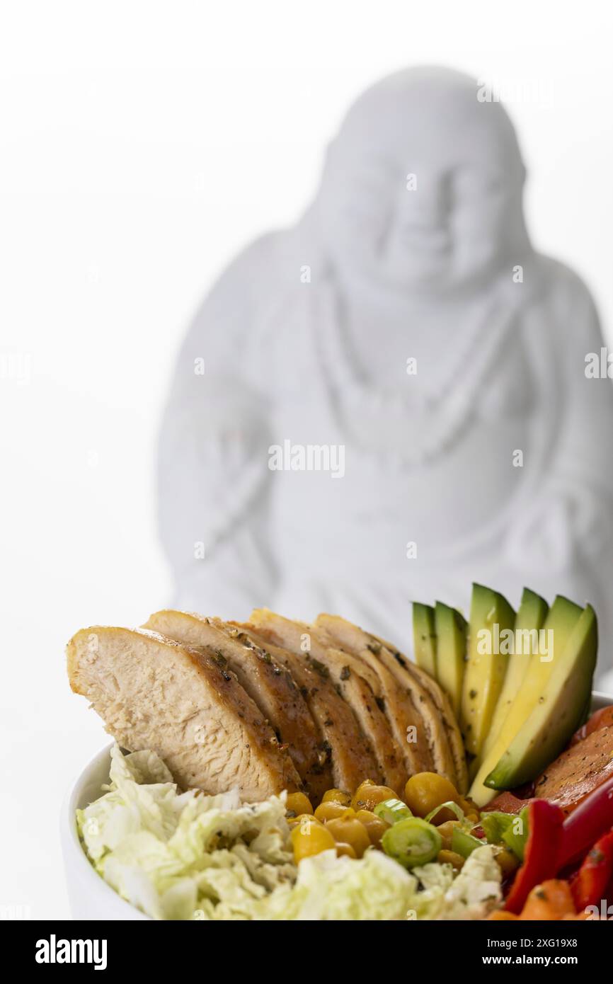 Buddha bowl with chicken on white Stock Photo - Alamy
