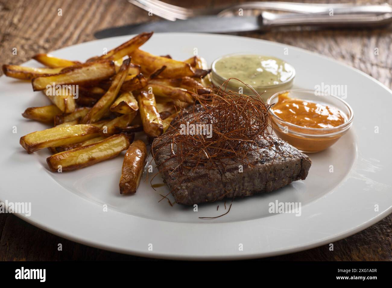 Steak with chilli and chips Stock Photo - Alamy