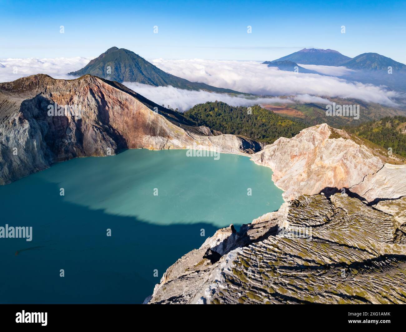 Aerial view Kawah Ijen volcano with turquoise sulfur water lake at sunrise.Amazing nature ...