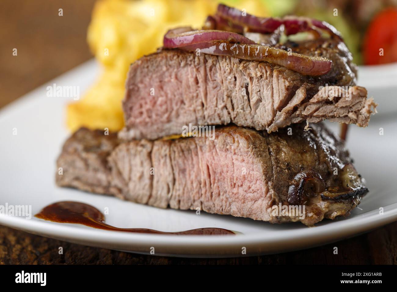 Steak slices on a plate Stock Photo - Alamy