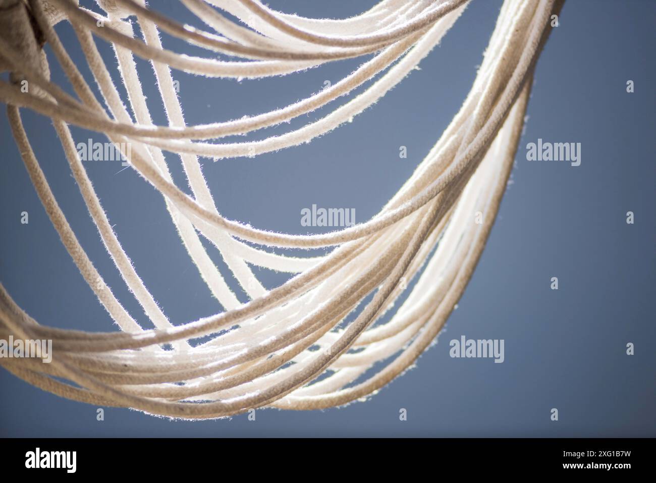 Cotton ropes hanging Stock Photo - Alamy