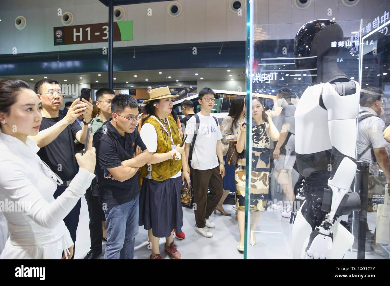 Visitors check out Tesla's second-generation Optimus humanoid robot ...