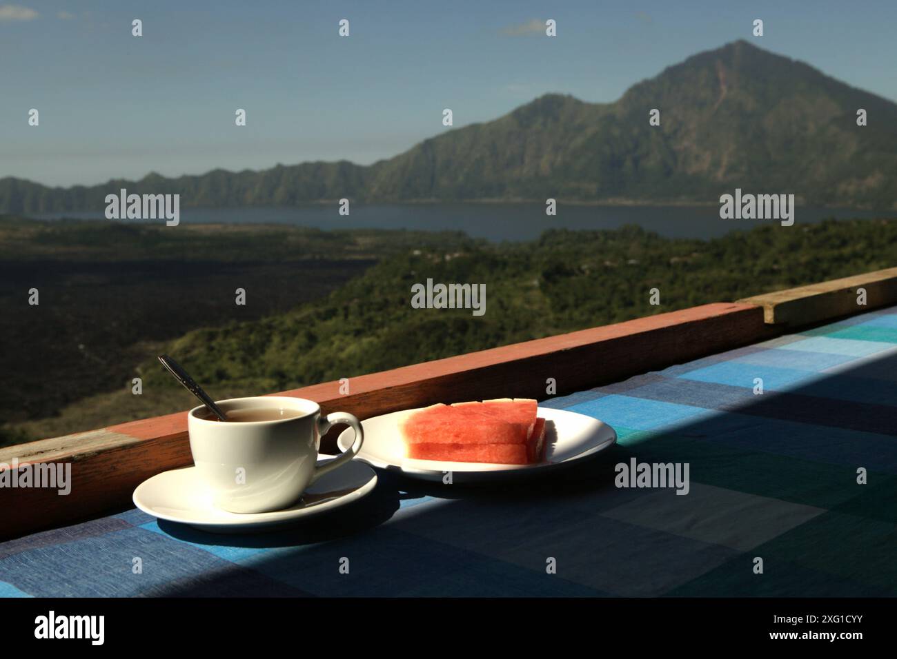 Water melon and tea on a restaurant's table in a background of Mount ...