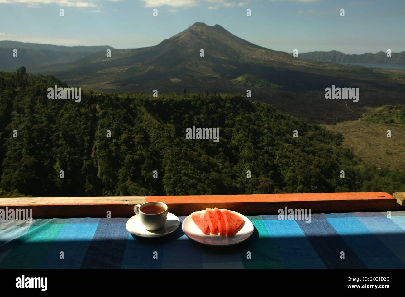 Water melon and tea on a restaurant's table in a background of Mount ...