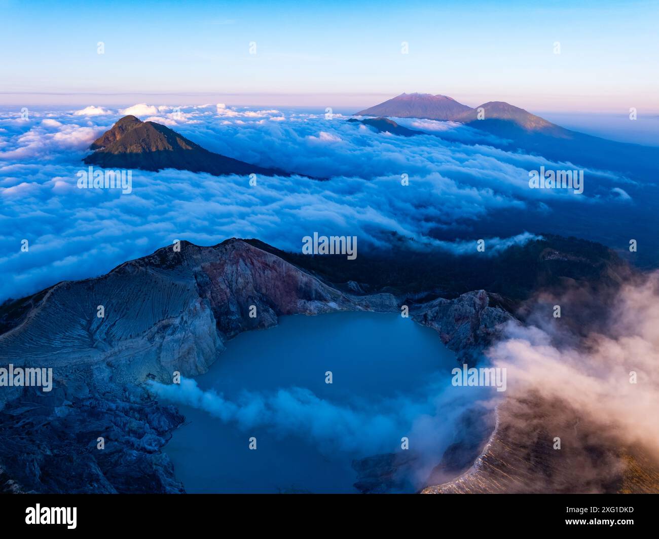 Aerial view Kawah Ijen volcano with turquoise sulfur water lake at sunrise.Amazing nature ...