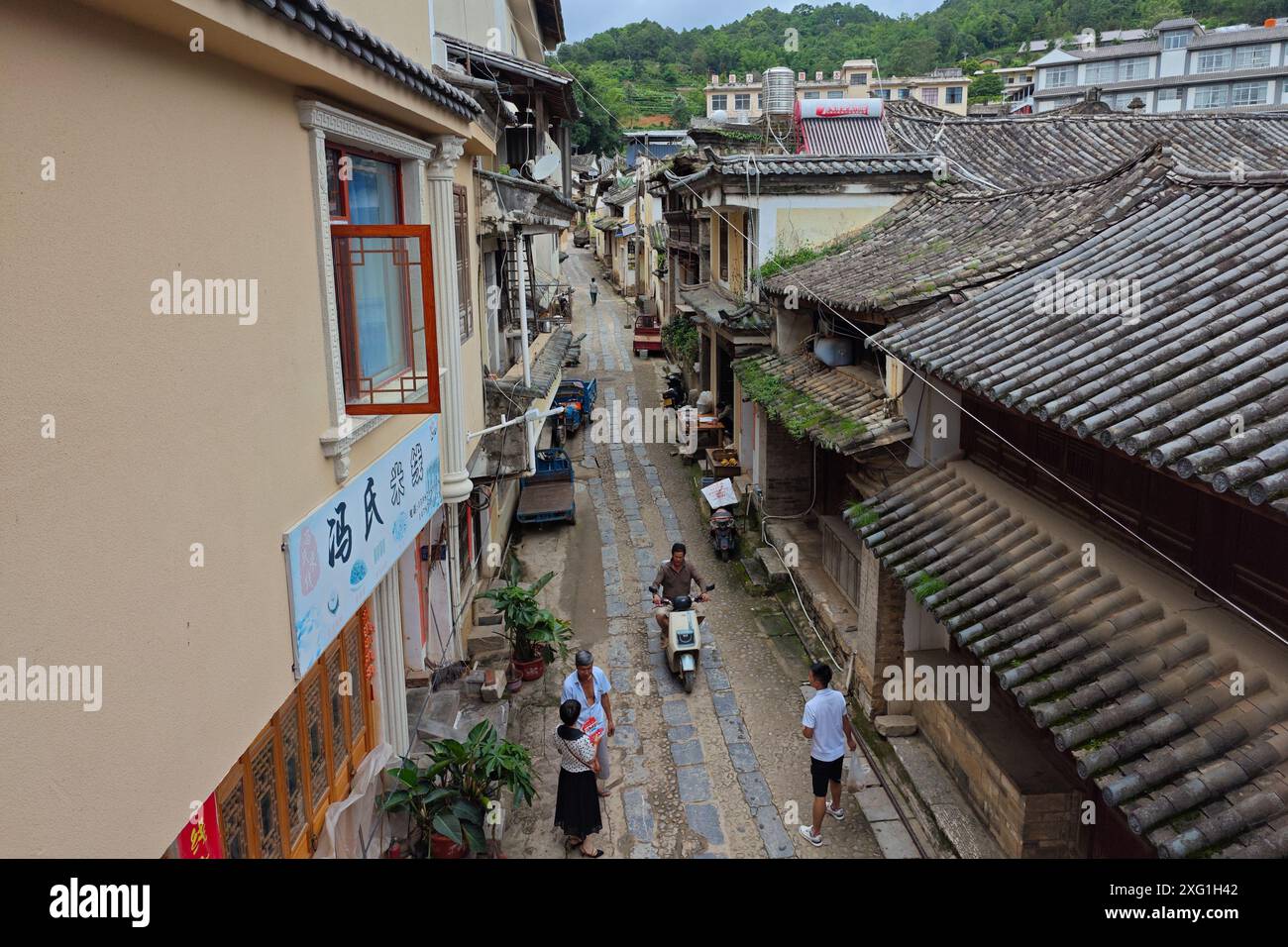 PU'ER, CHINA - JULY 1, 2024 - Tourists visit Bixi Ancient Town in Pu ...