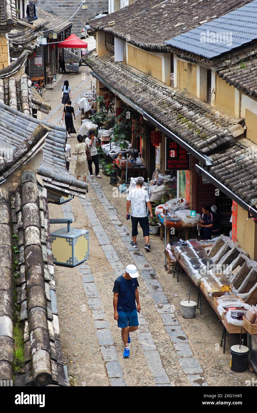 PU'ER, CHINA - JULY 1, 2024 - Tourists visit Bixi Ancient Town in Pu ...