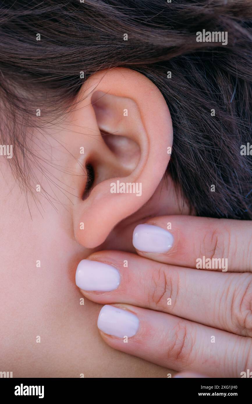 Paediatric endocrinologist , examining swollen lymph nodes of a young ...