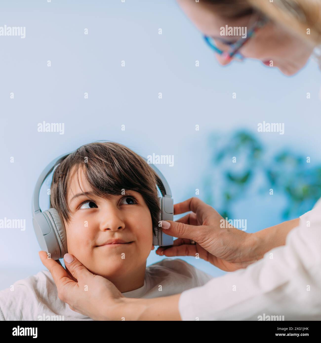 Boy having a pure tone audiometry test Stock Photo - Alamy