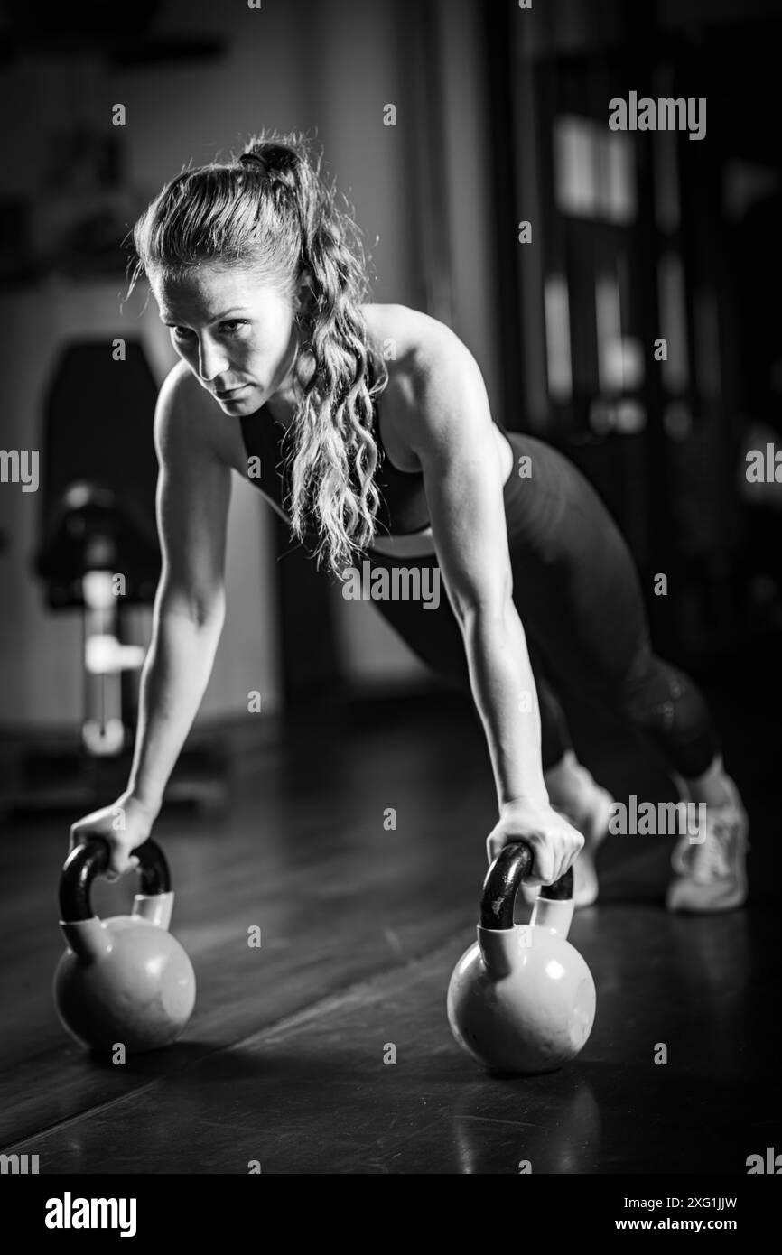 Strong woman lifting kettlebells hi-res stock photography and images - Alamy