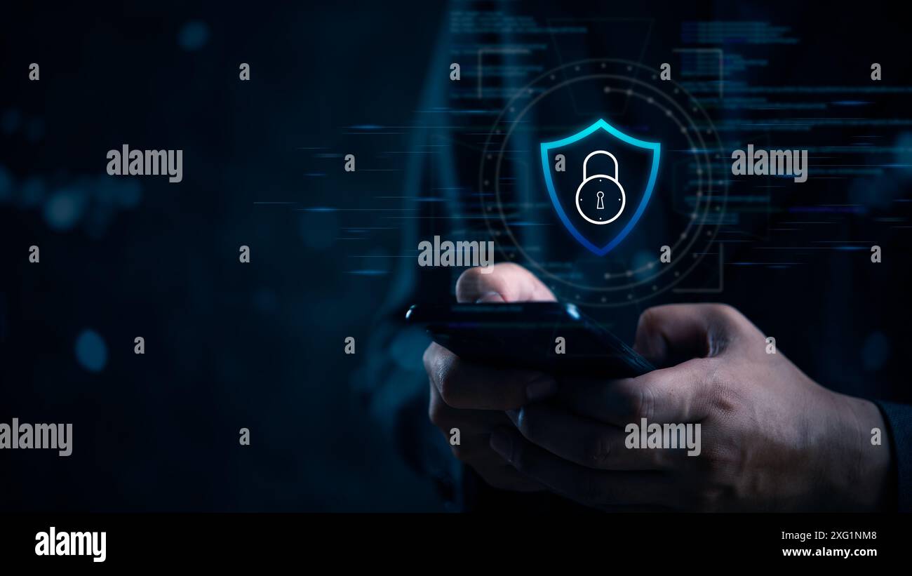 Hand holding smartphone with digital shield lock symbol, representing ...