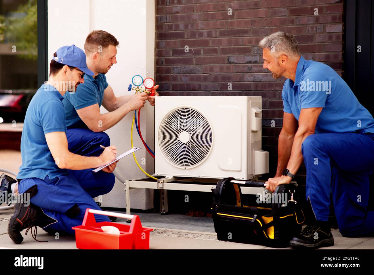 Experienced Technician Inspecting Air Conditioning Units and Installing ...