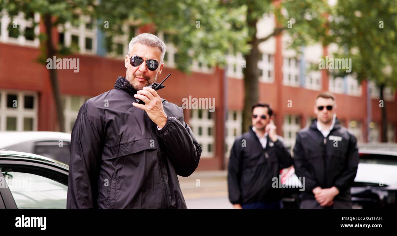 Professional VIP security guard safeguarding business executives near ...