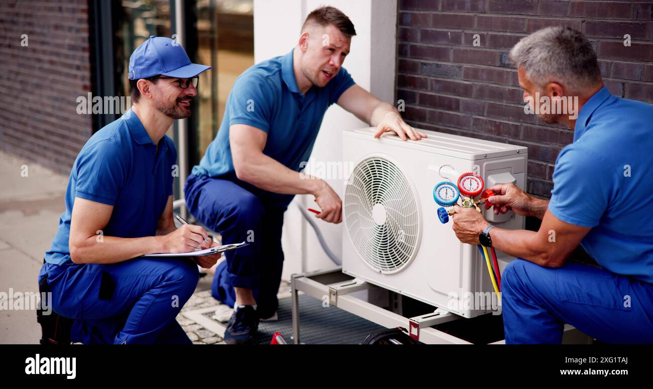 Professional Electrician Leading Team in HVAC Maintenance Service ...