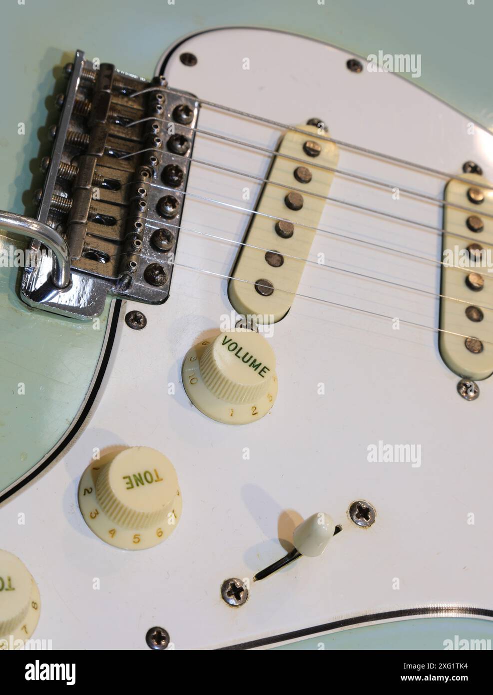 Vintage electric guitar volume and Tone knobs and pickups under the six ...