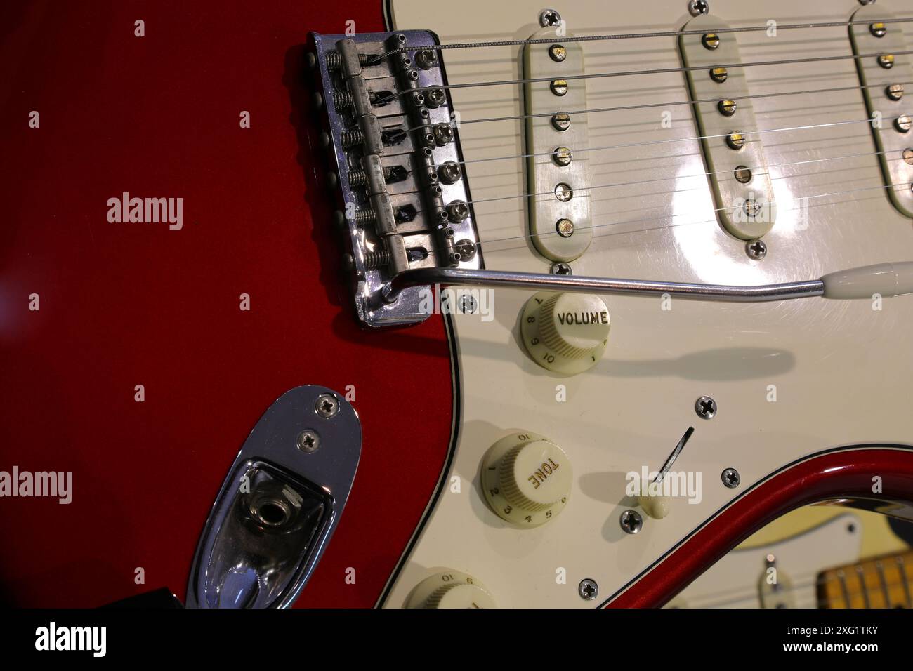 Detail of electric guitar with lever that is used to create the vibrato ...
