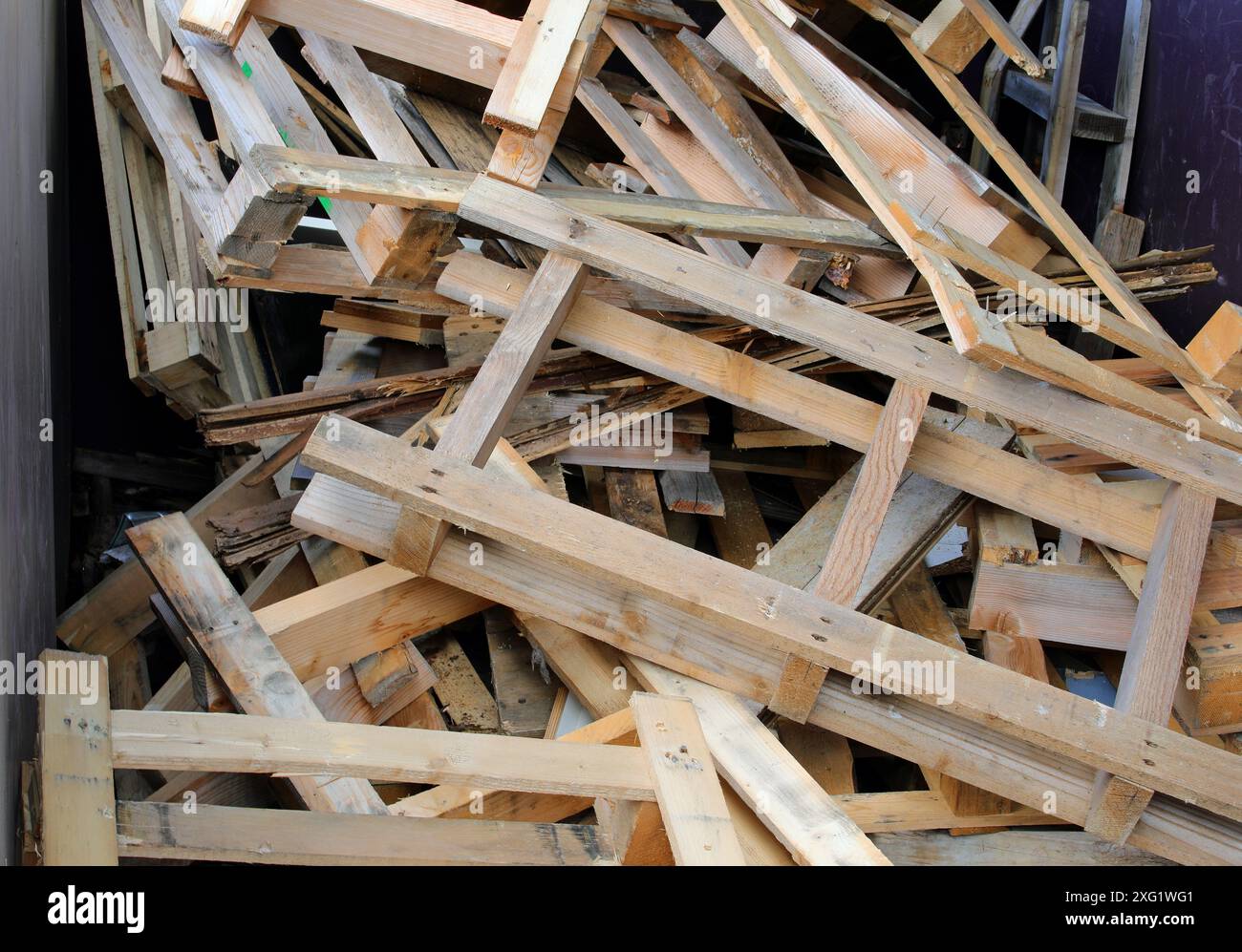 large industrial waste container filled with wooden pallets ready for ...